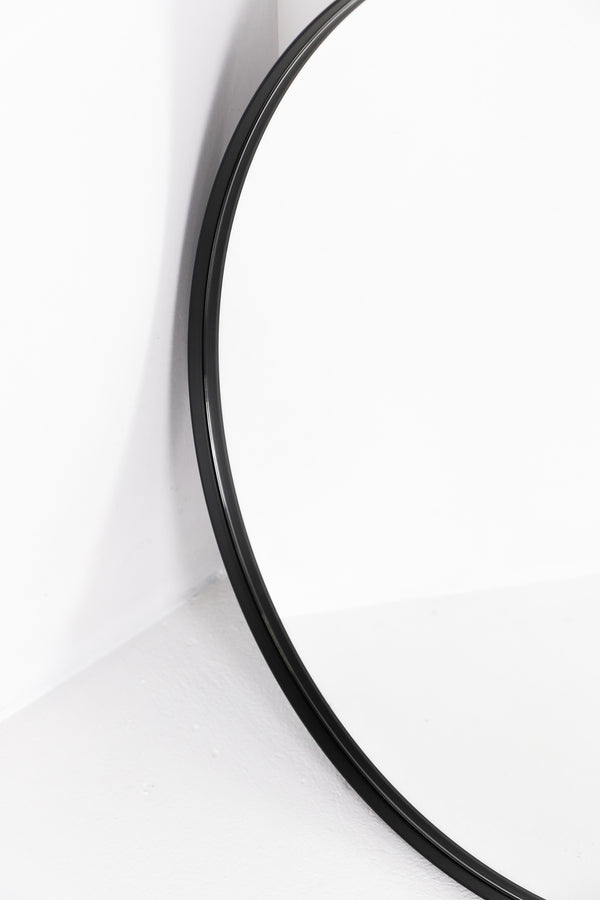 Round mirror set back in black frame - The Framing Project